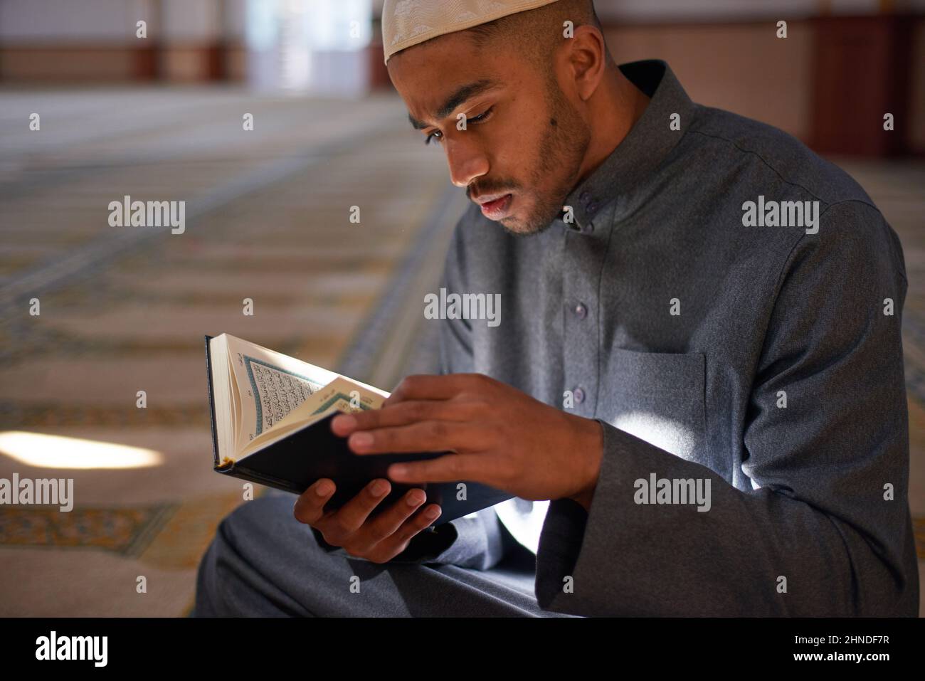 Ethnic male reading book hi-res stock photography and images - Alamy