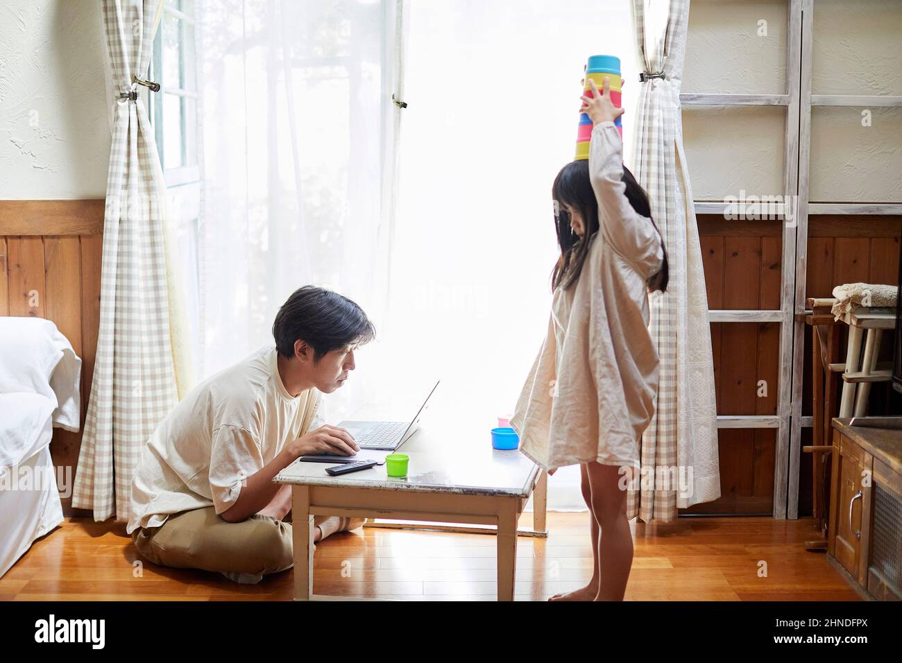 Working from home family devices hi-res stock photography and images ...