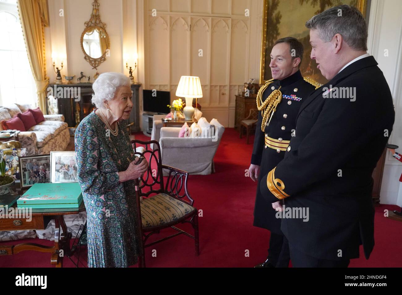 Queen Elizabeth II with Rear Admiral James Macleod and Major General Eldon Millar (right) as she ...