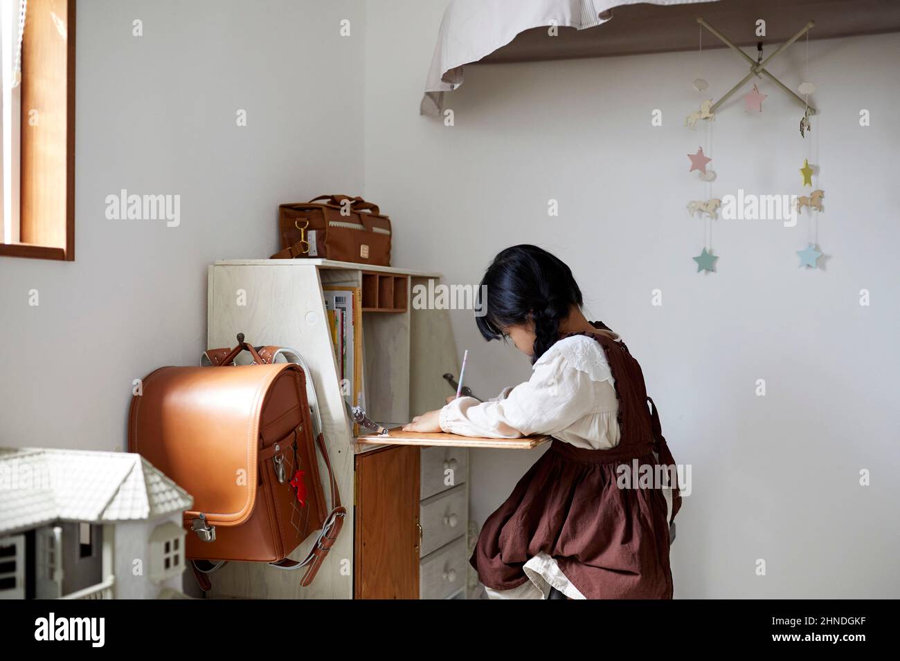 Japanese Girl Doing Her Homework Stock Photo - Alamy