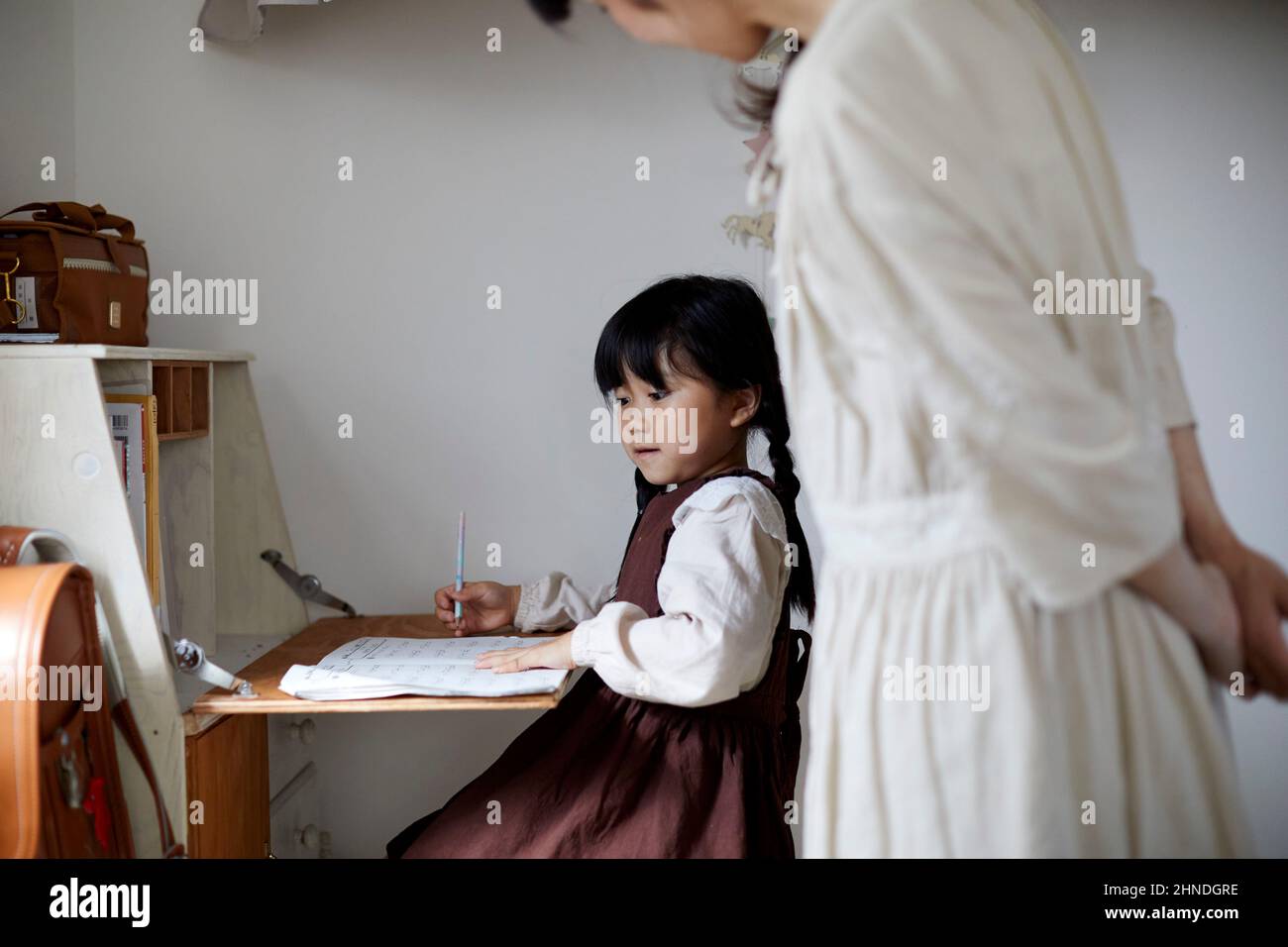 Asian family daughter doing homework hi-res stock photography and ...