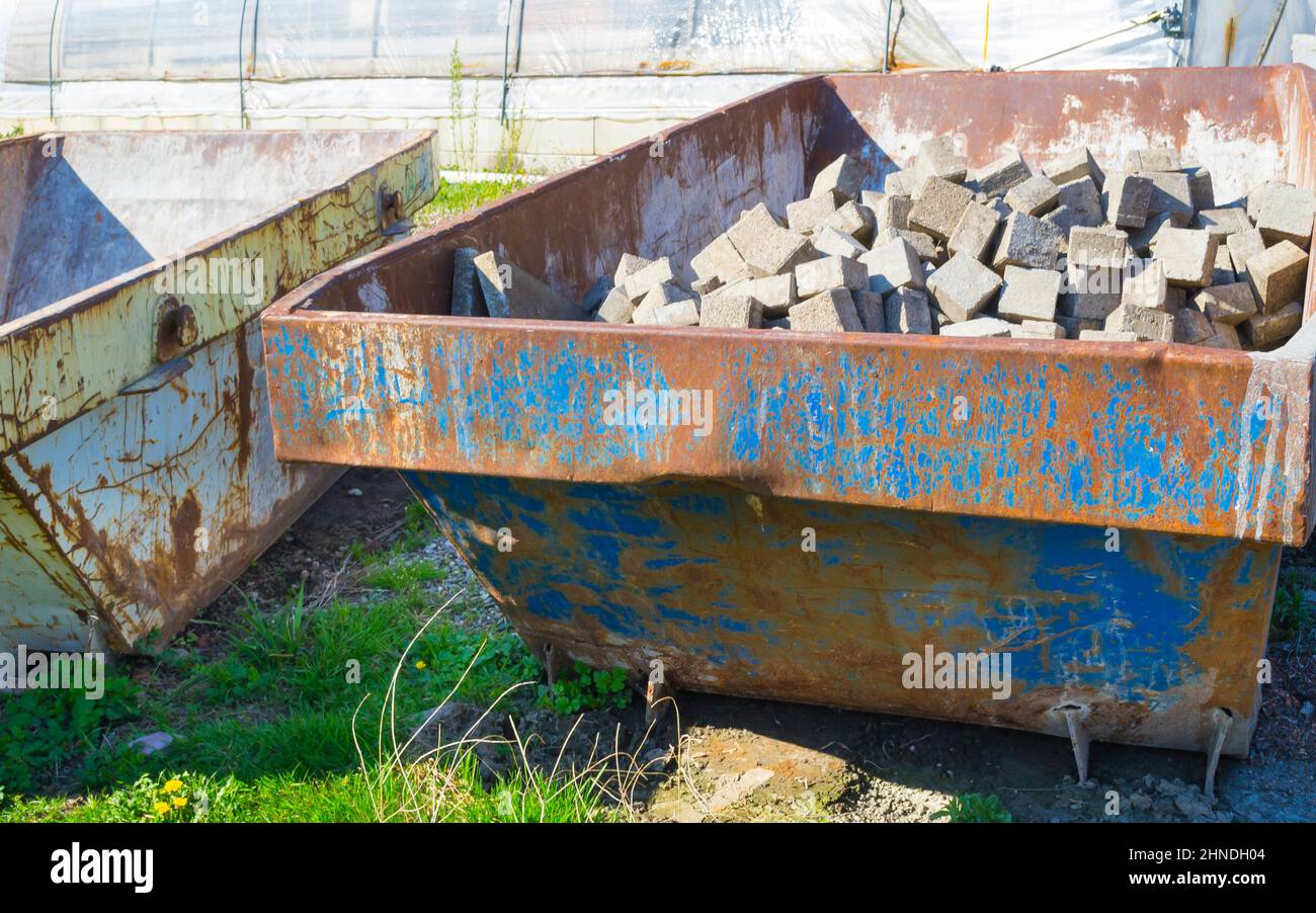 Building container for old cast-off material. Bricks, cobbles, stones ...