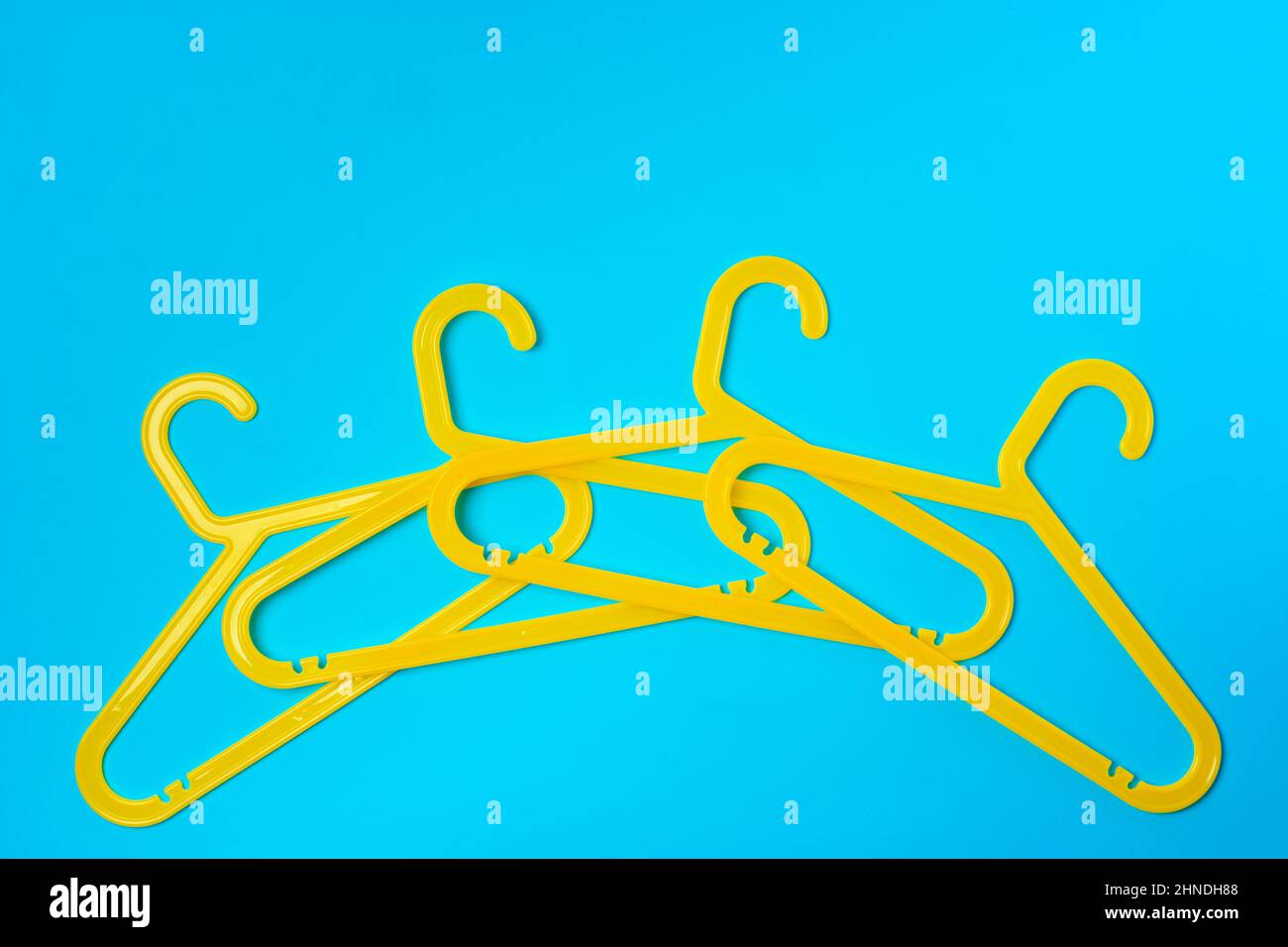 Blue hanger on trendy blue color background. Template fashion blog ...