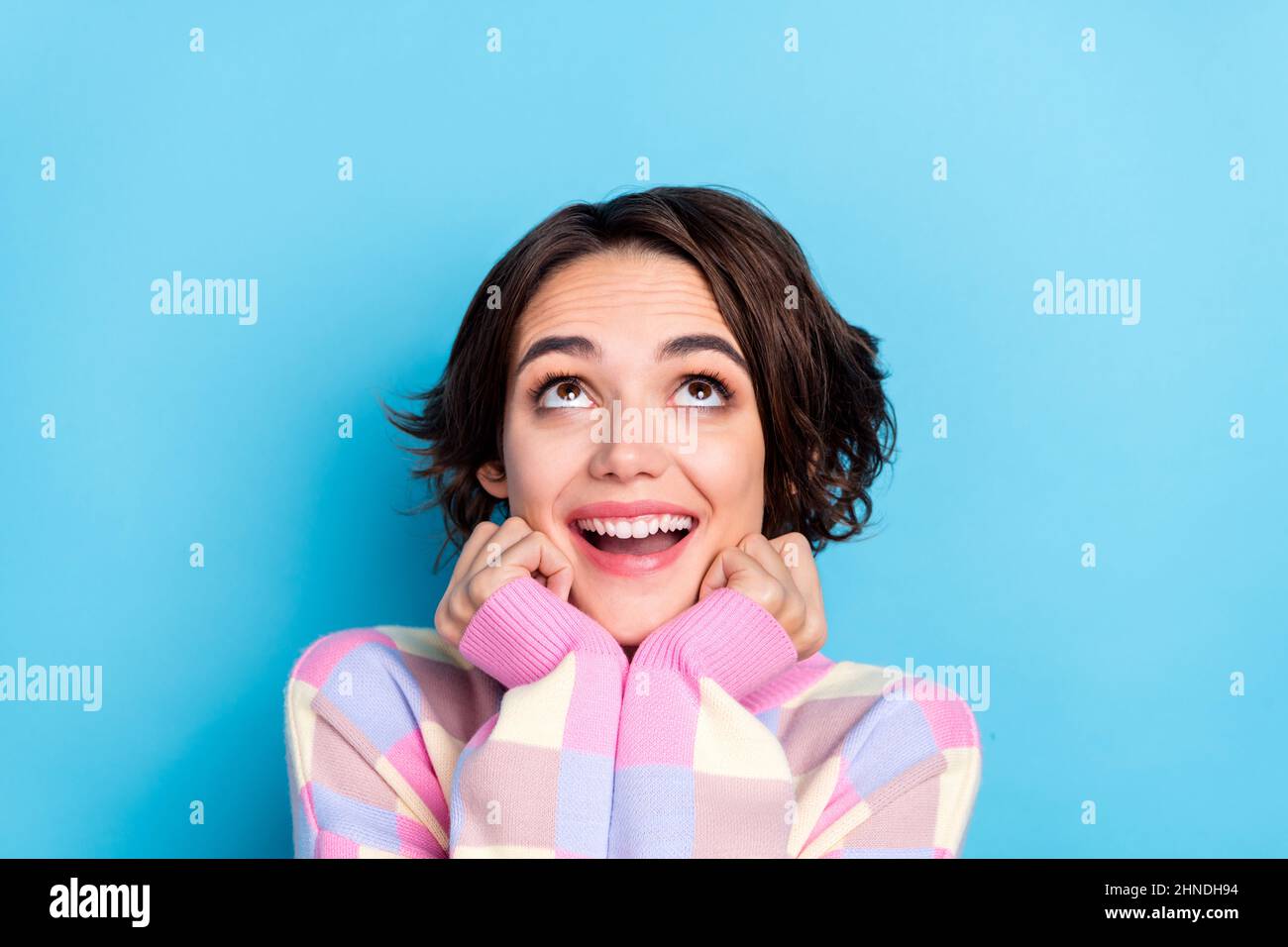 Photo of young pretty excited girl curious look empty space imagination ...
