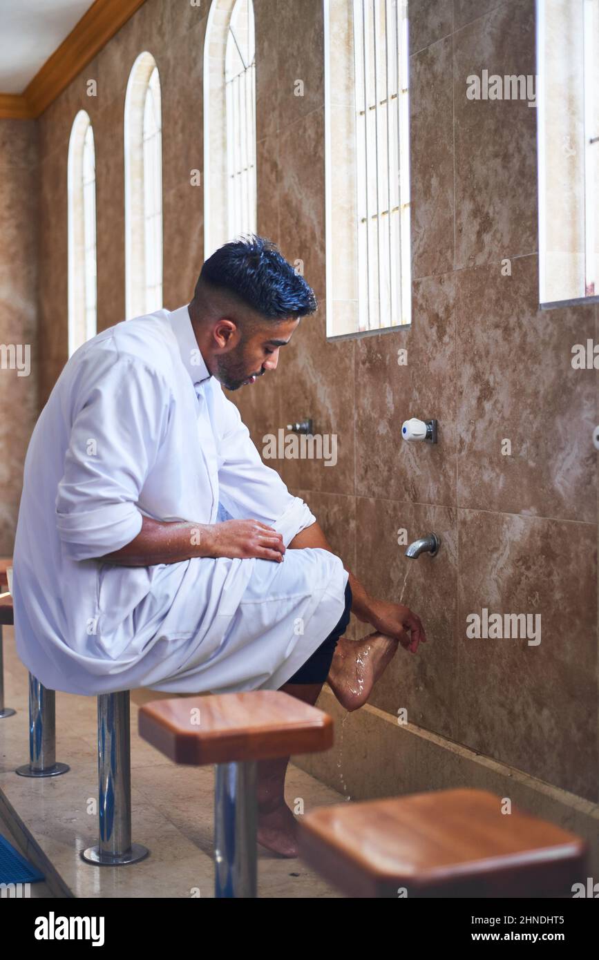 A Muslim man cleansing his feet in the mosque washroom Stock Photo - Alamy