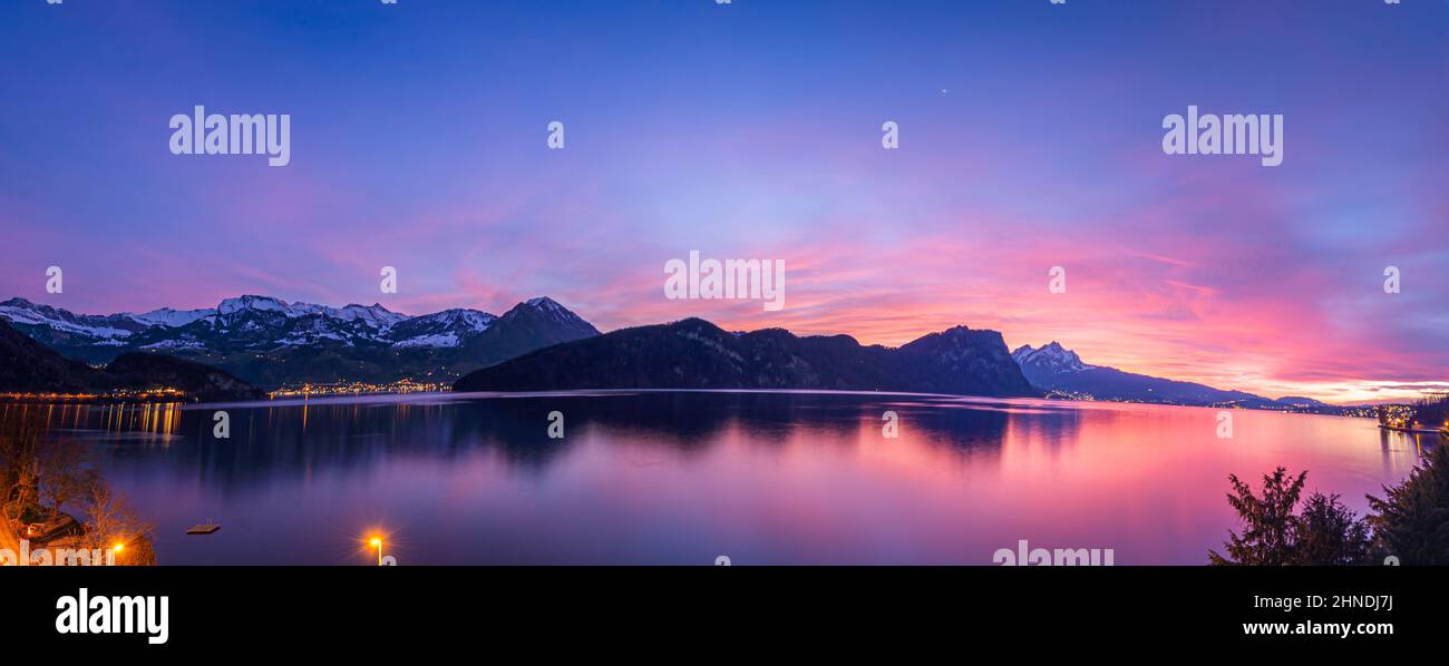 Night panorama. Switzerland. Spectacular sunset over the mountains and ...