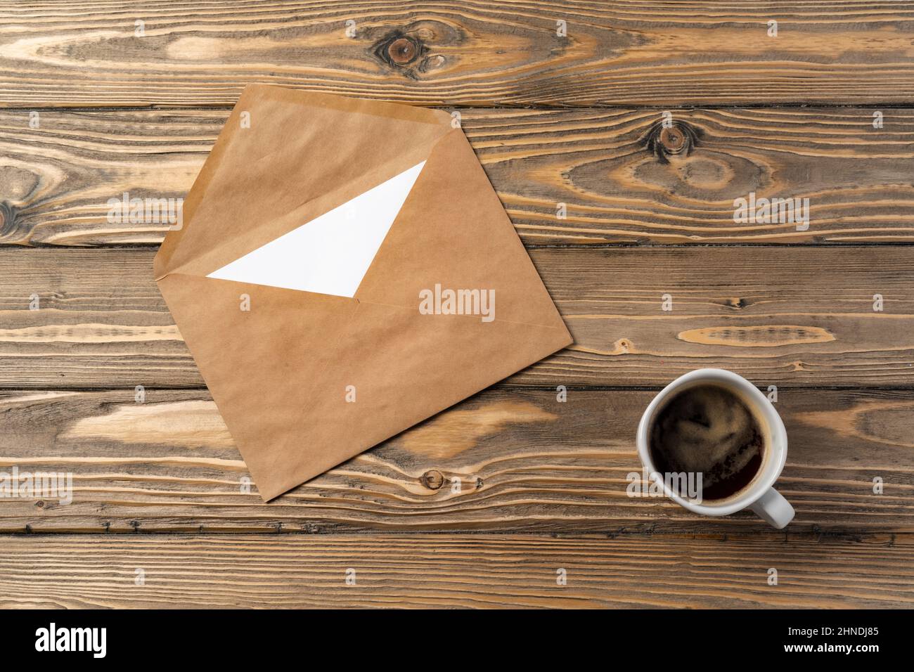 Vintage envelope with empty card, pen on wooden table top view Stock ...