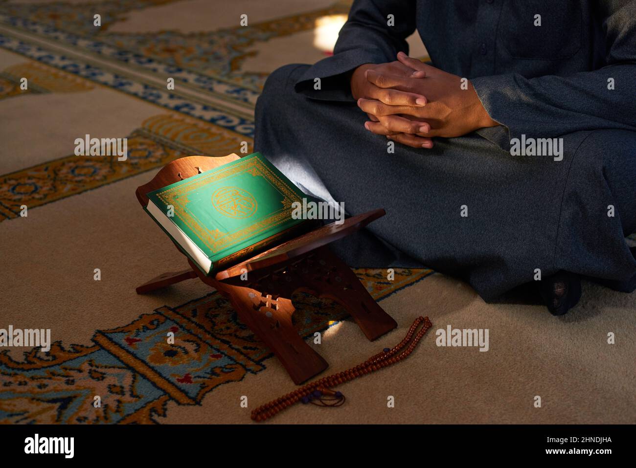 A close up of the Quran on a stand inside a mosque Stock Photo - Alamy