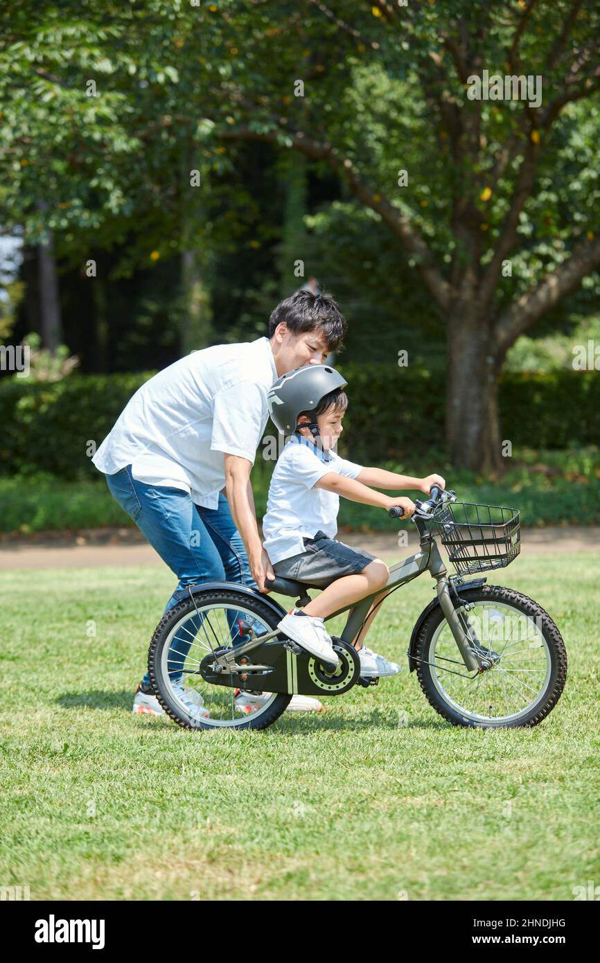 Child riding bicycle side view helmet hi-res stock photography and ...