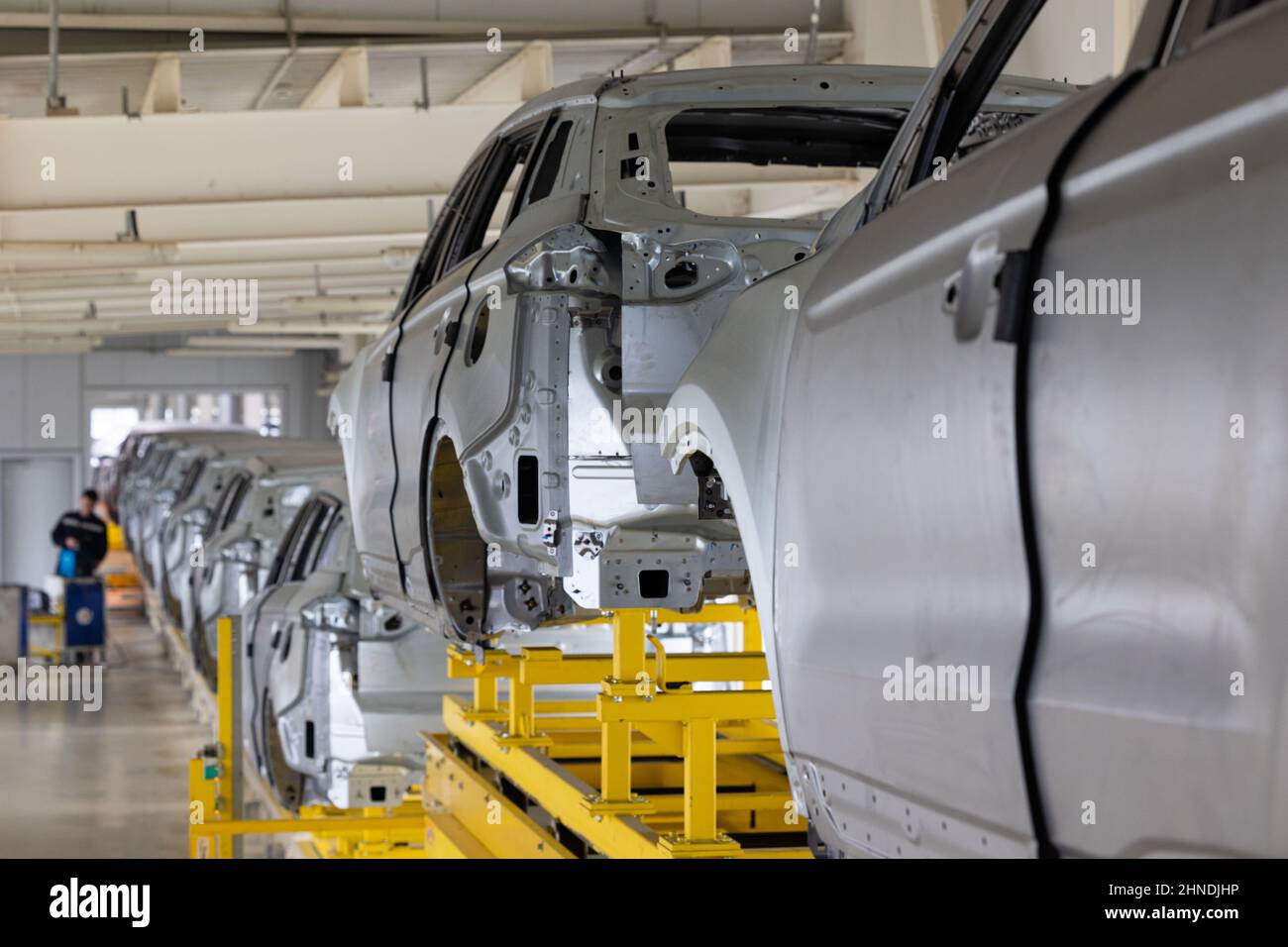 Photo of automobile production line. Modern car assembly plant. Modern ...