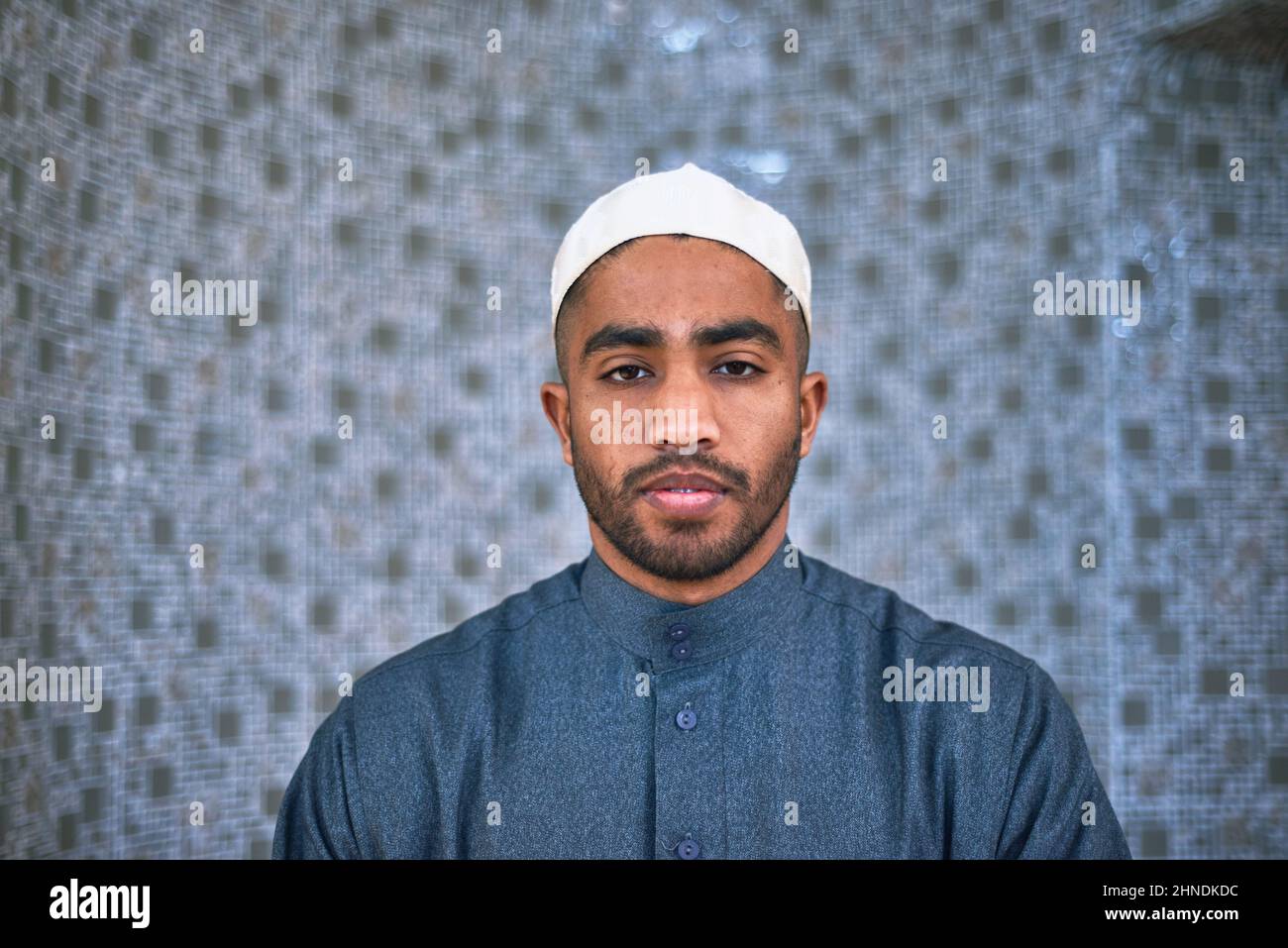 A portrait of a young Muslim man in a mosque looking serious Stock ...