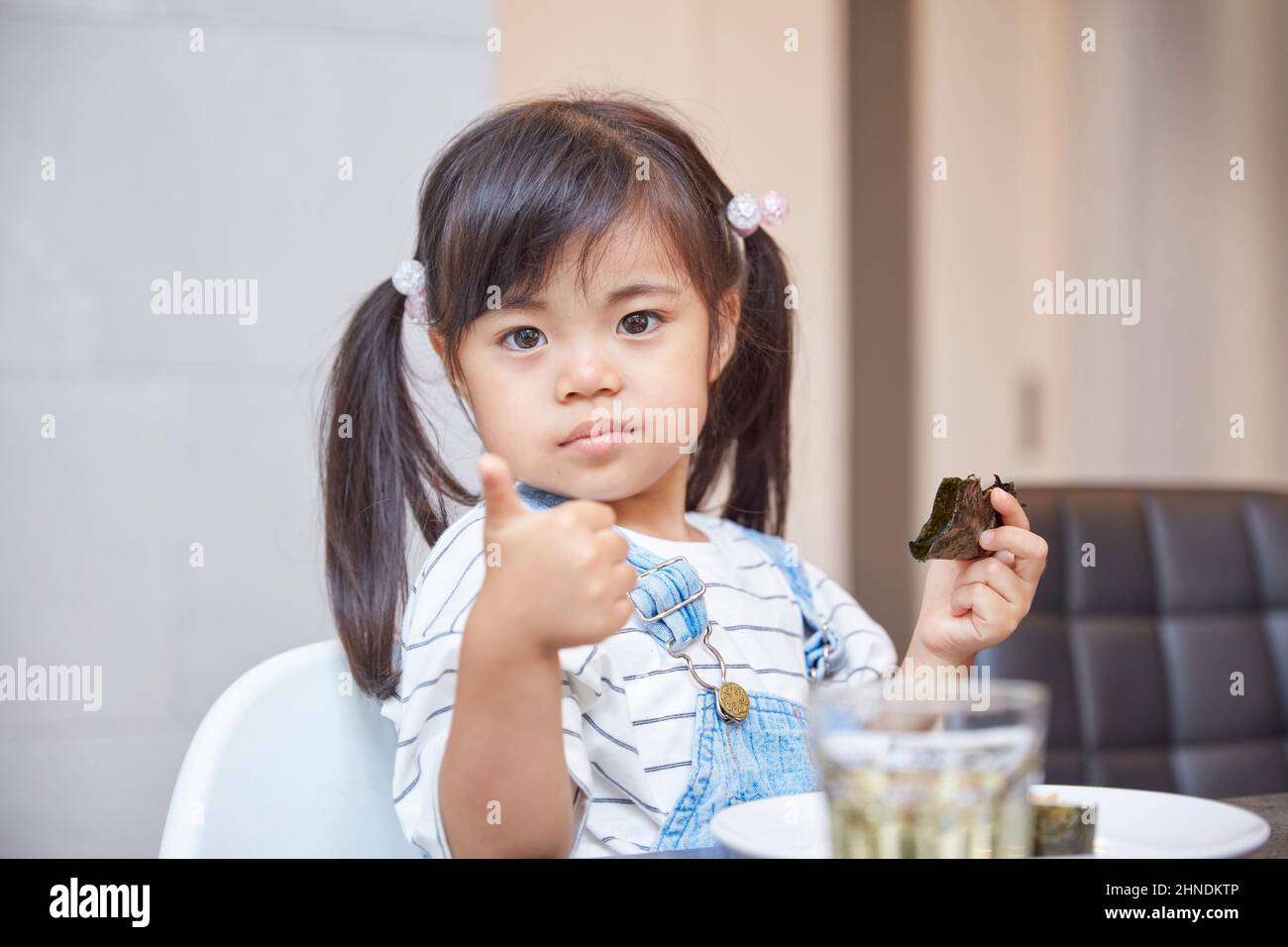 Happy asian child eating sushi hi-res stock photography and images - Alamy