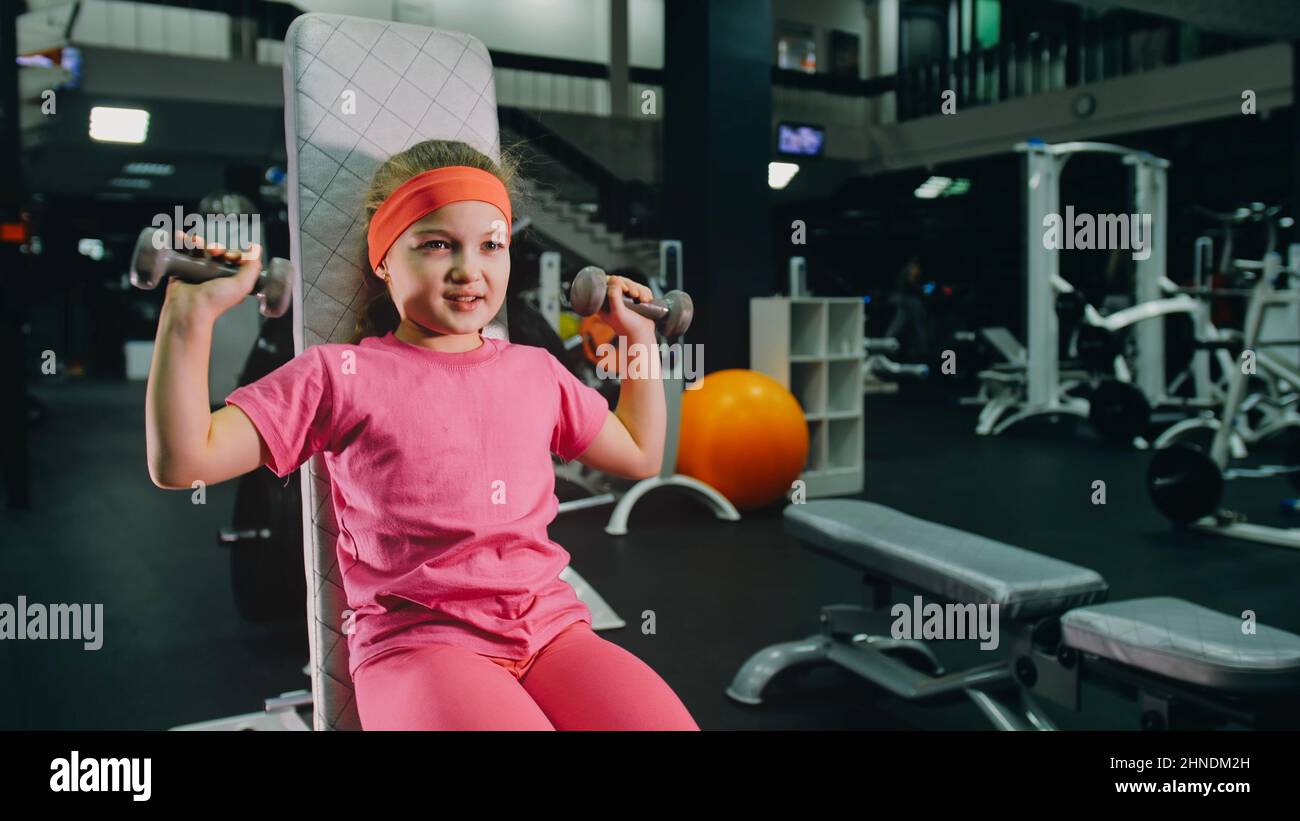 Fit Athletic Baby Girl Work out with Dumbbell, Doing Her Fitness ...