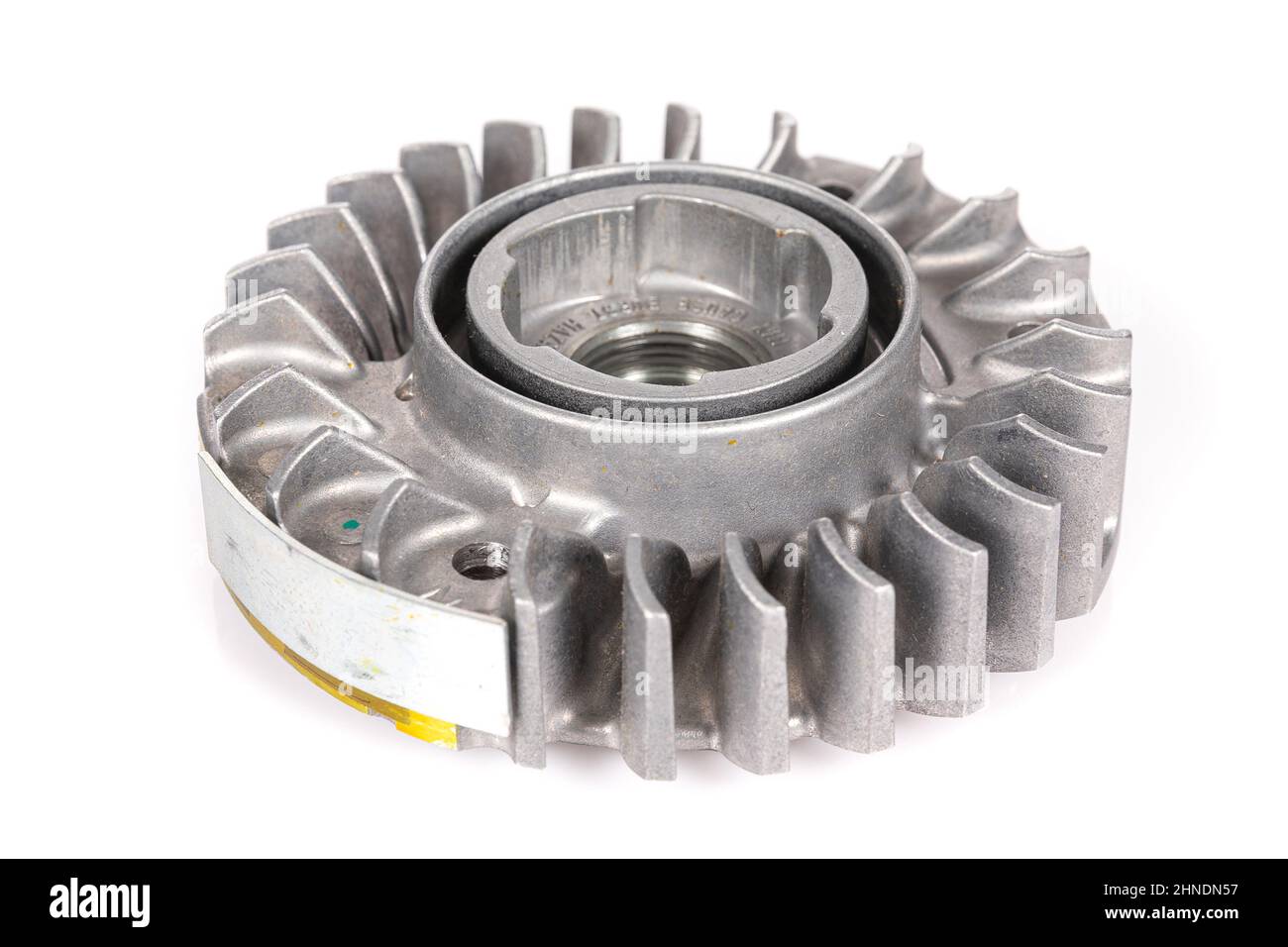 new aluminum modern flywheel close-up for a chainsaw on a white ...