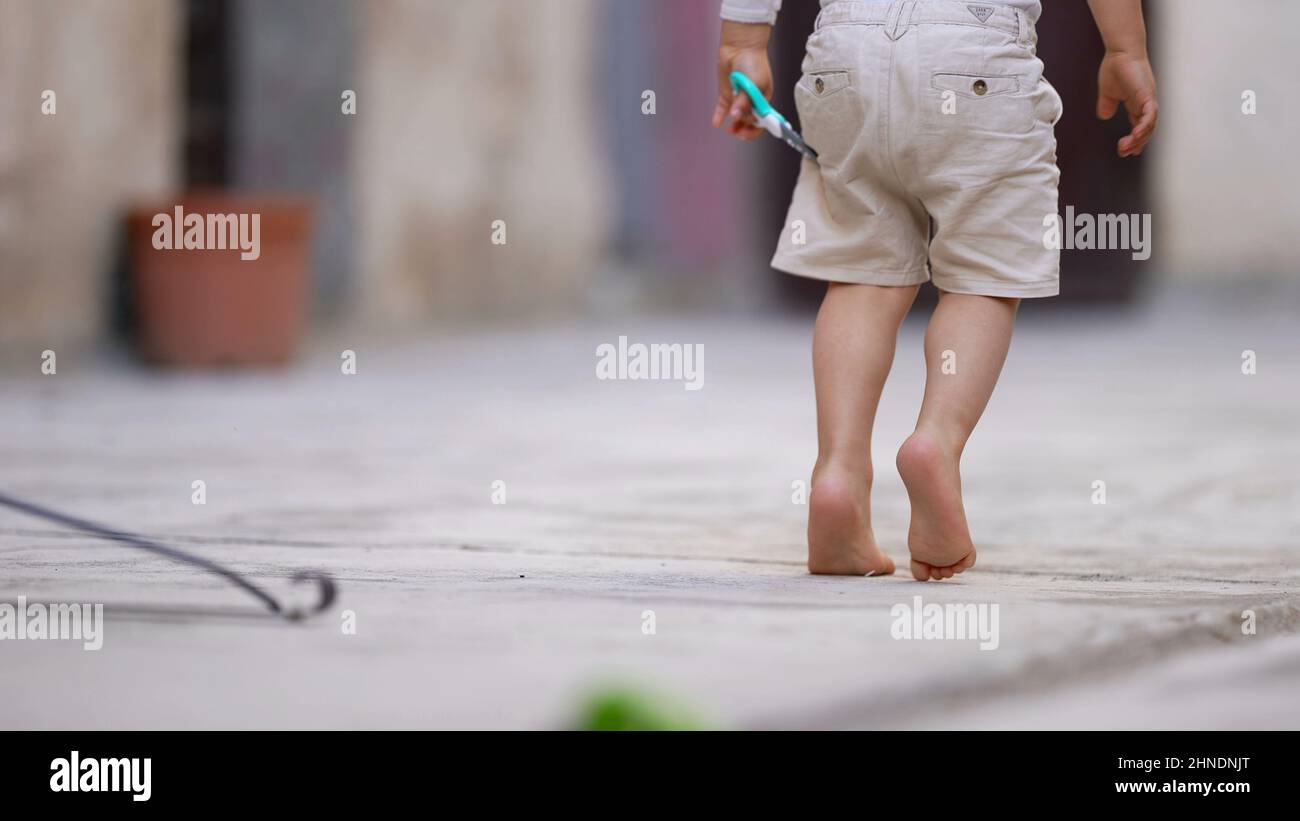 Child walking on tiptoes Stock Photo - Alamy