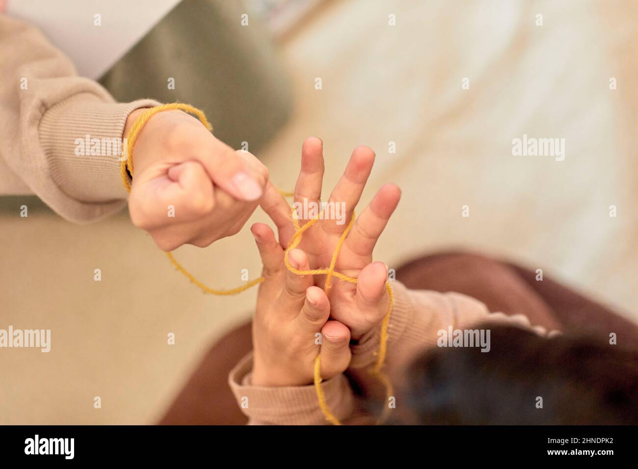 Japanese Girl Enjoying Playing Ayatori Stock Photo - Alamy