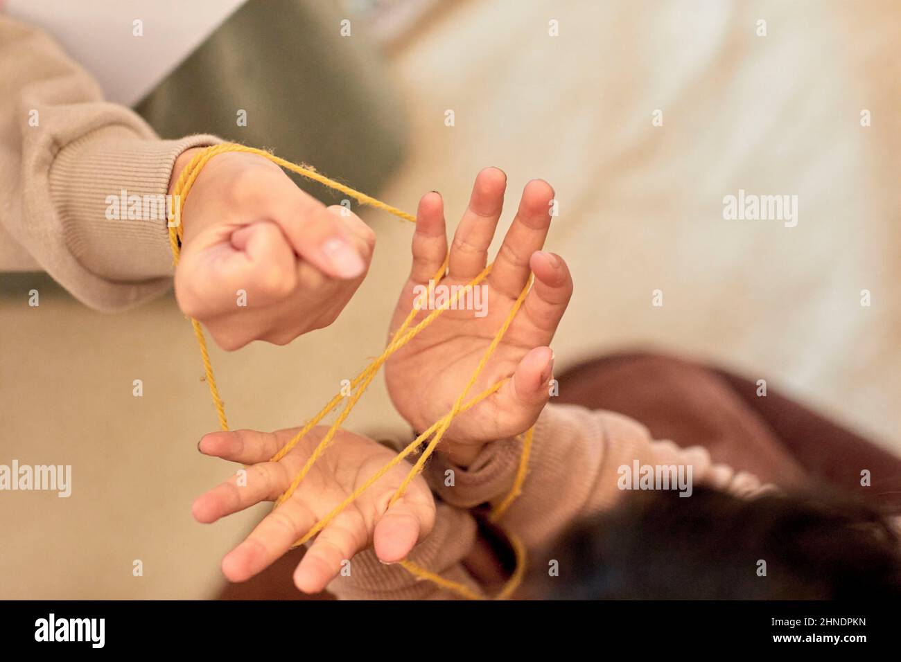 Japanese Girl Enjoying Playing Ayatori Stock Photo - Alamy