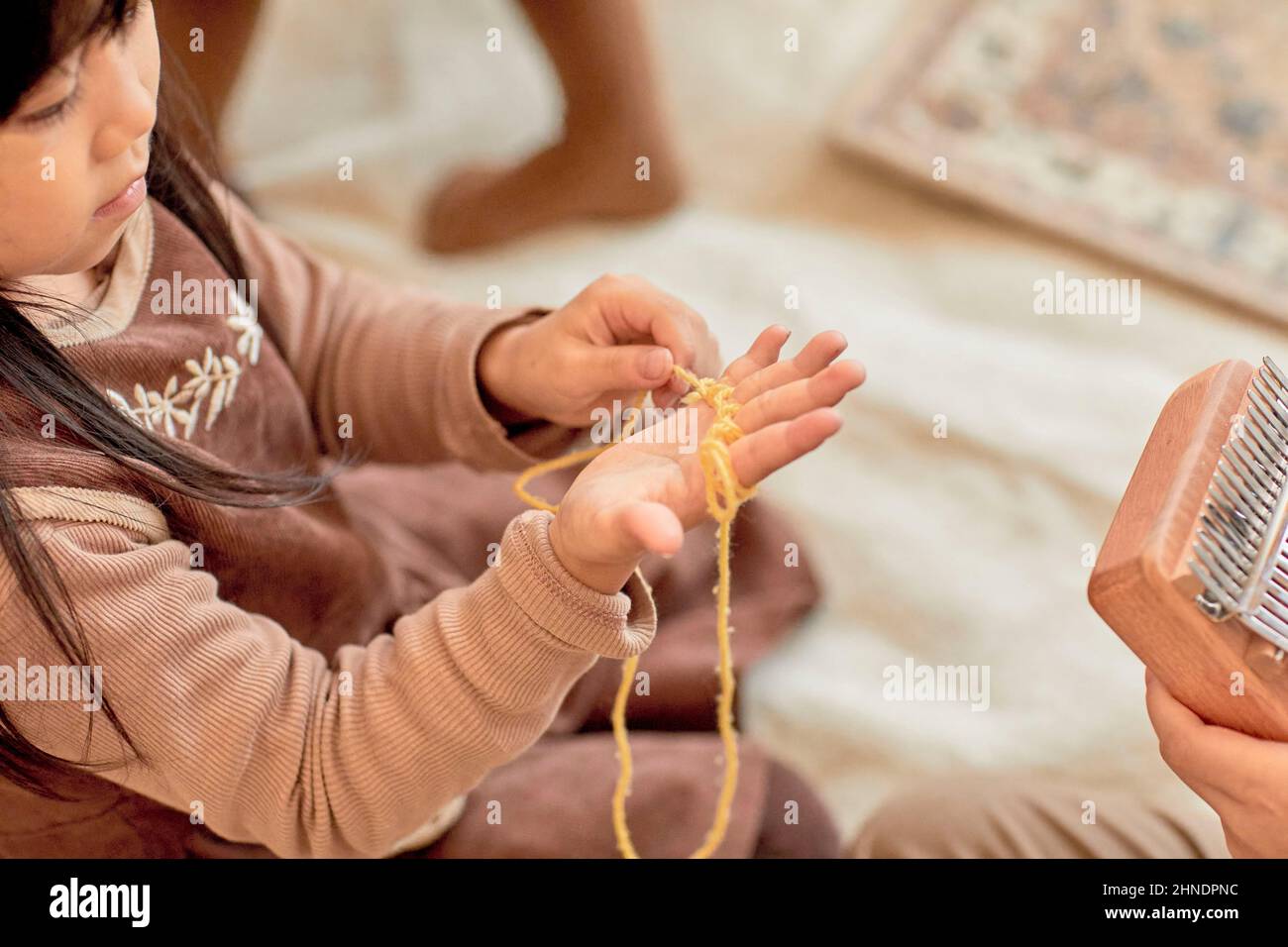 Japanese Girl Enjoying Playing Ayatori Stock Photo - Alamy