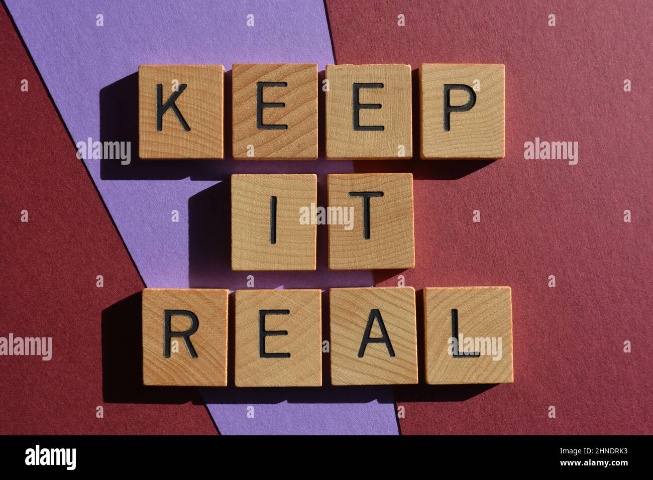 Keep It Real, words in wooden alphabet letters isolated on colourful ...