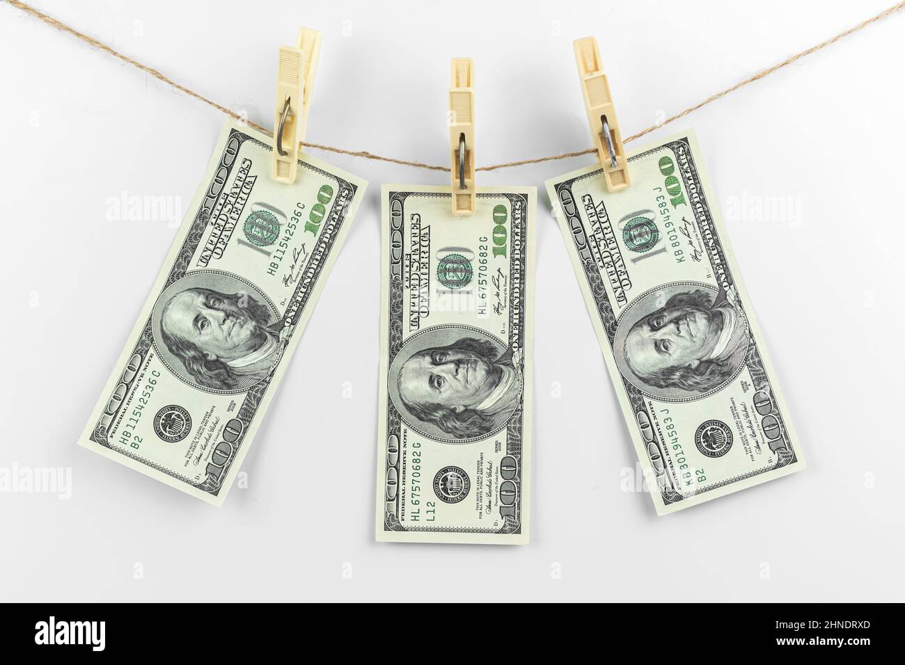 Money laundering. Dollar banknotes hanging on a rope. Corruption ...