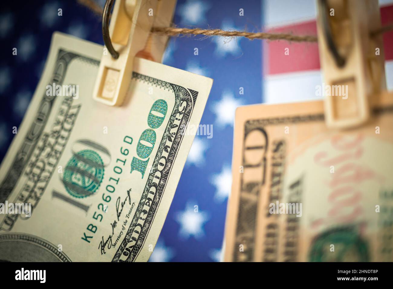 Money laundering with US dollars hung out to dry on American flag ...