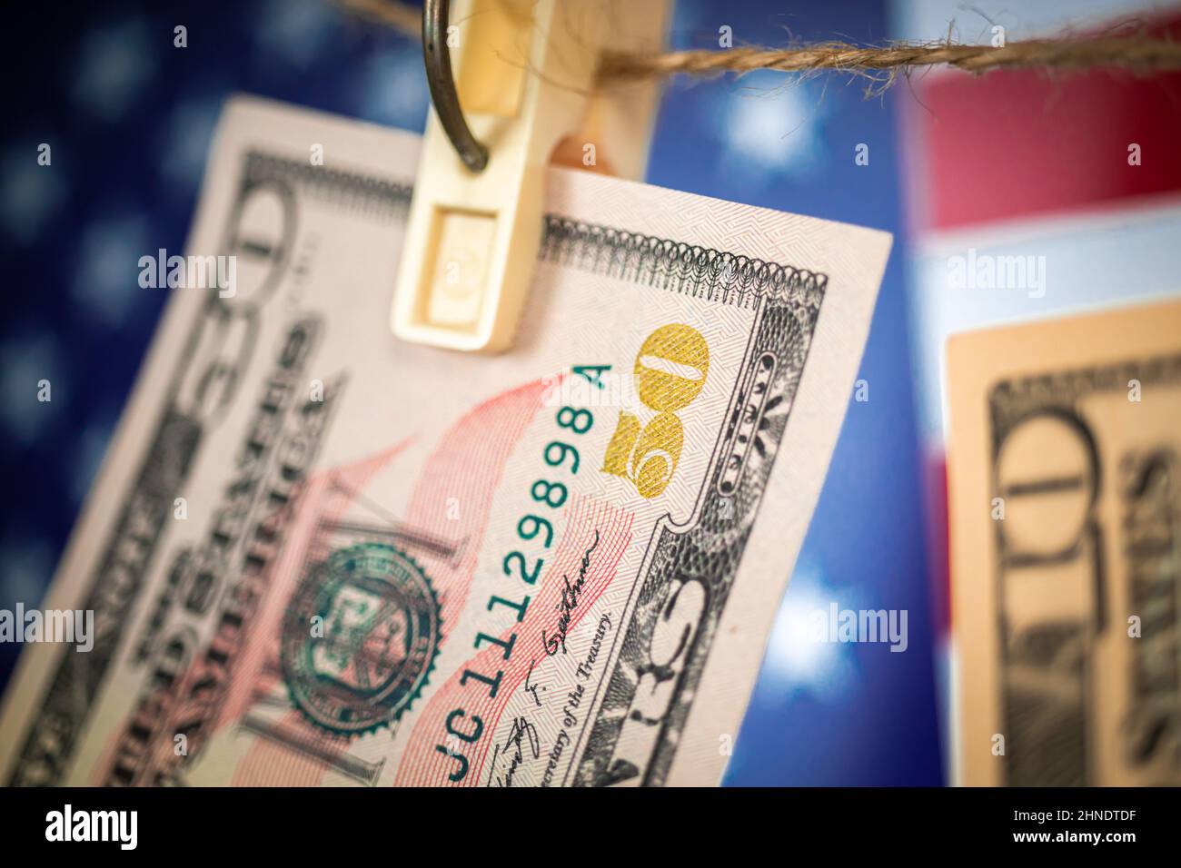 Money laundering with US dollars hung out to dry on American flag ...