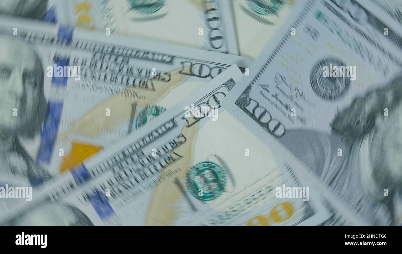 Many dollar are arranged around the edges of the image as a frame ...