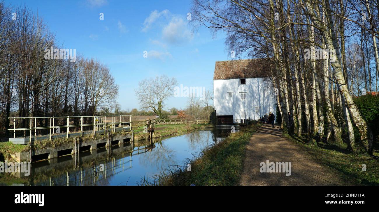 Watermill and Mill stream at Lode in Cambridgeshire with trees and blue ...