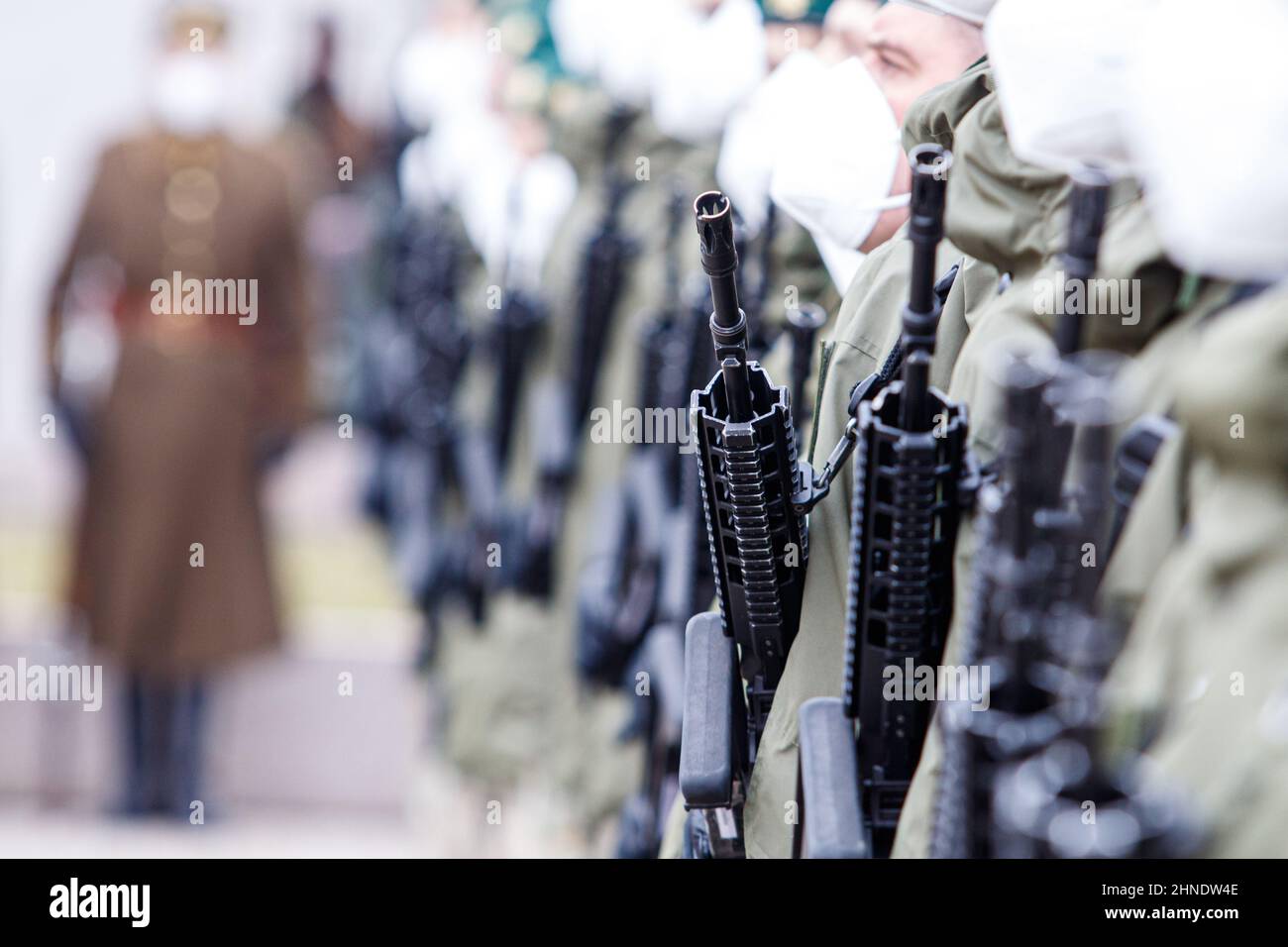 Lithuanian NATO soldier holding gun. The North Atlantic Treaty ...