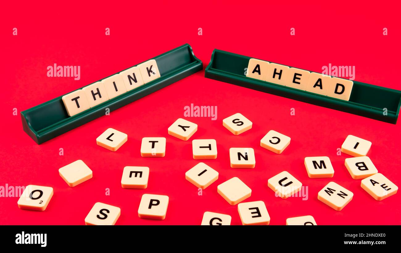 Selective focus on the tile which combine to form a word think ahead on ...