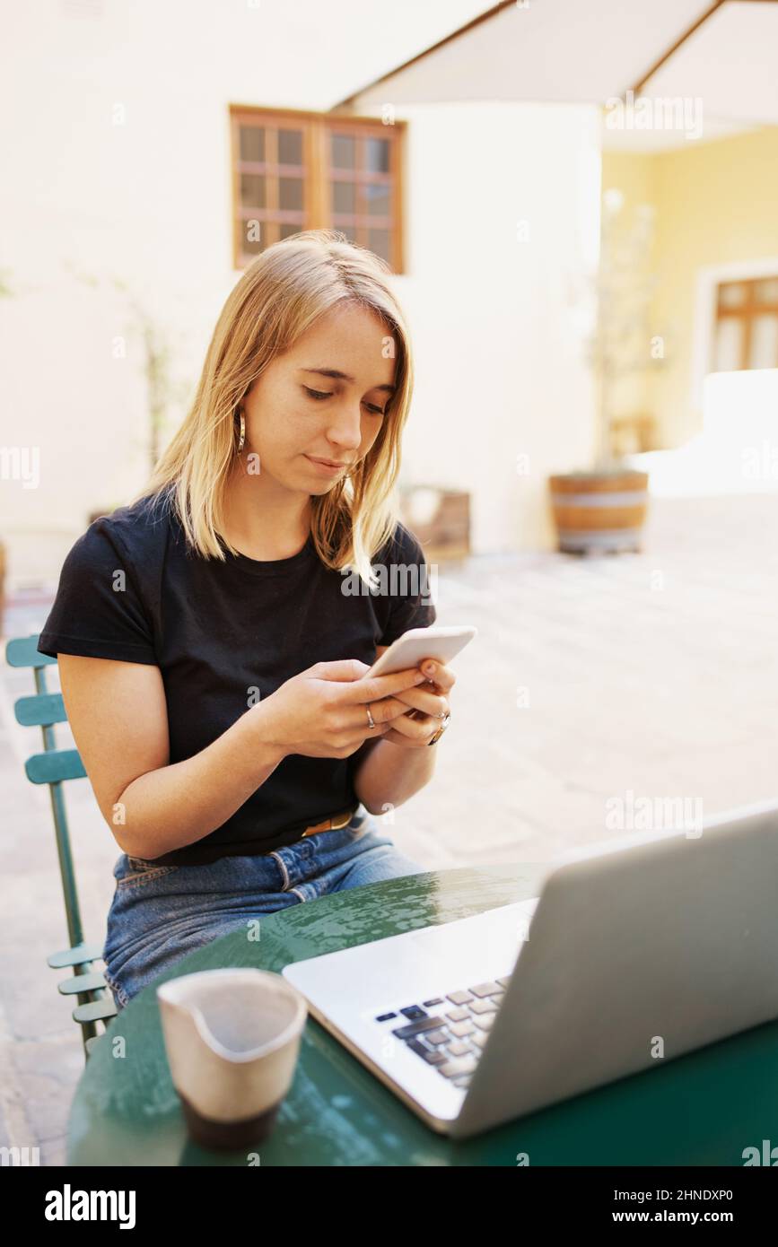 Enjoying some wireless connectivity at the cafe Stock Photo - Alamy