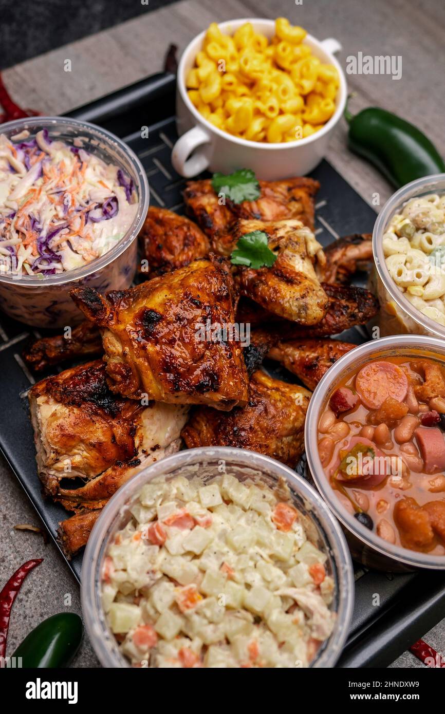 Lunch tray with salads and grilled chicken Stock Photo - Alamy