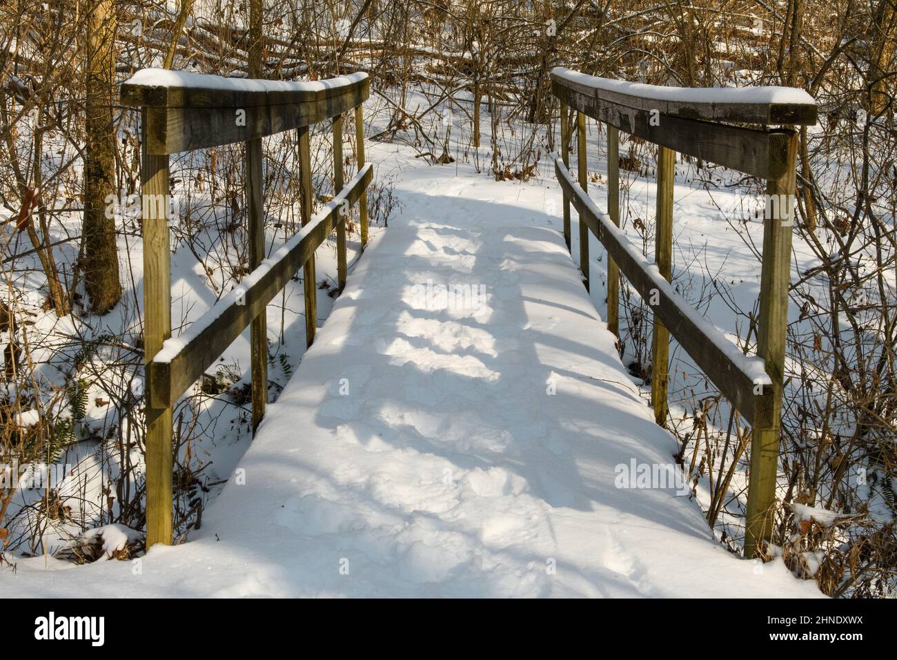 Small wooden bridge covered with snow Stock Photo - Alamy