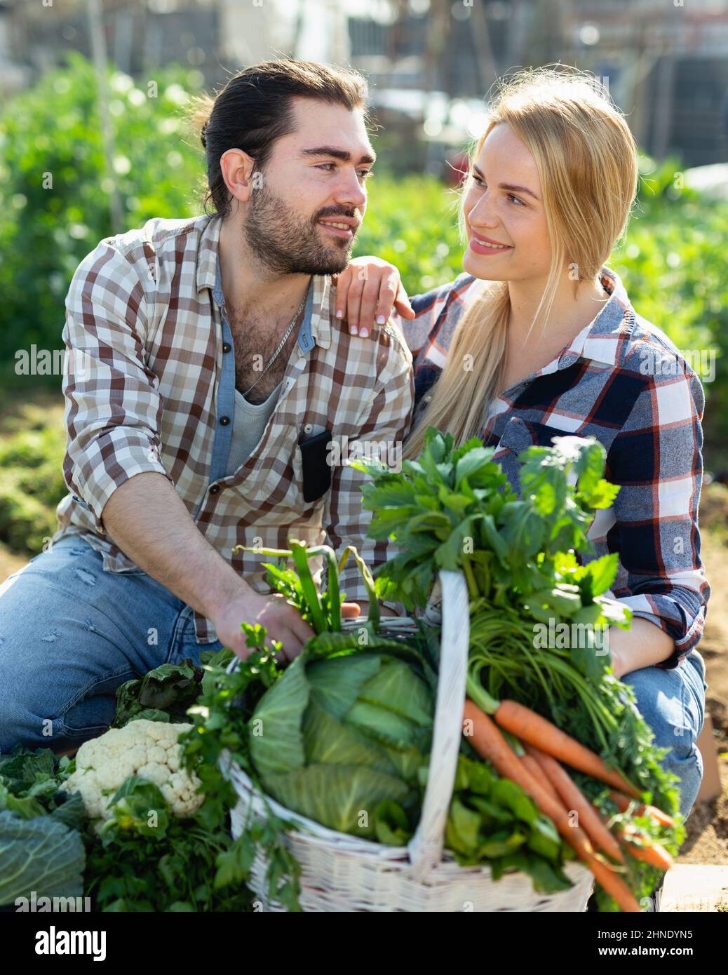 Gardeners posing with vegetables harvest Stock Photo - Alamy