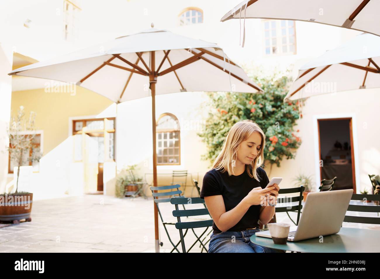 Chill time consists of coffee and connectivity at a cafe Stock Photo ...