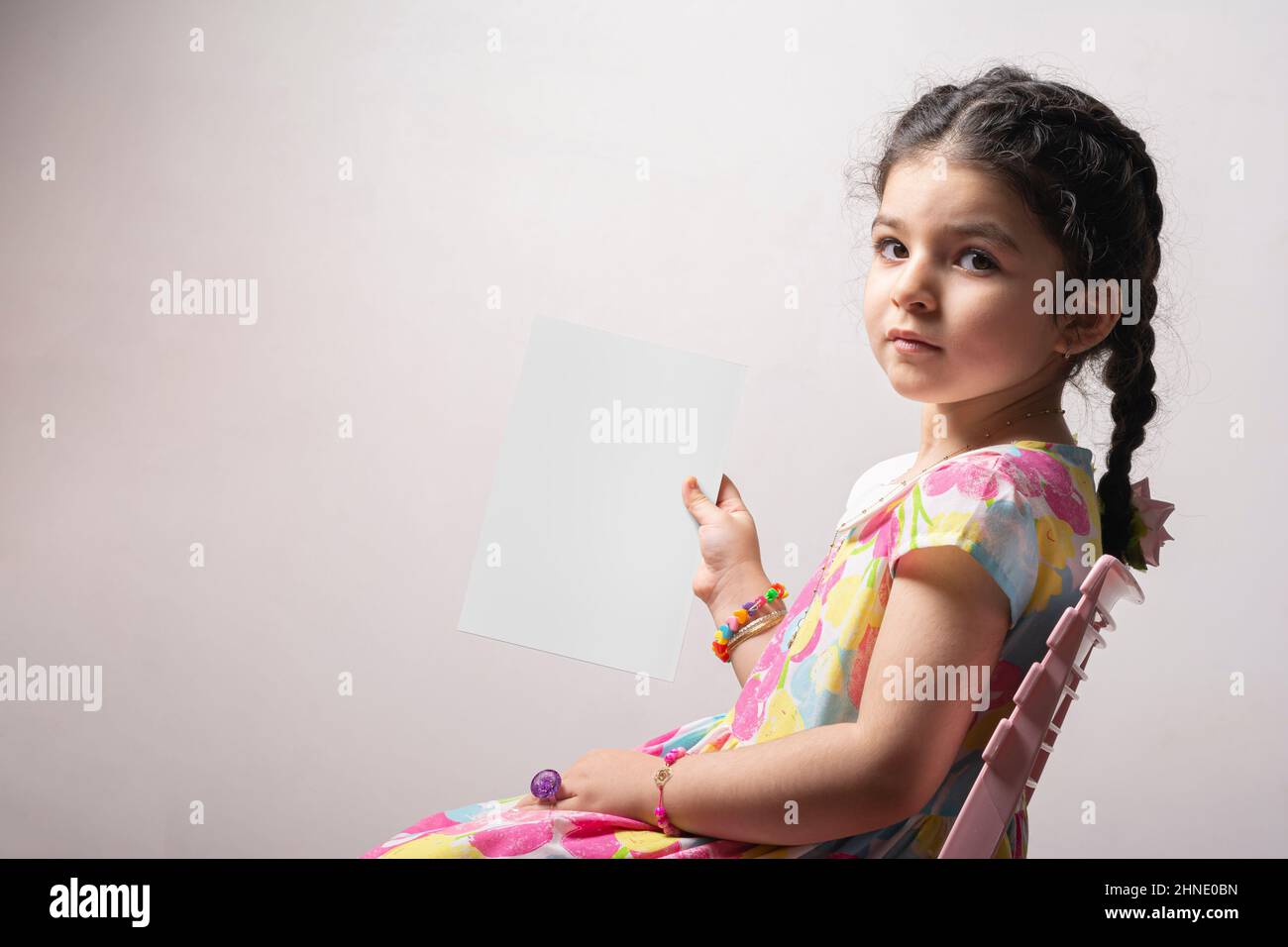 Little girl holding a story book with blank cover, book cover selection ...