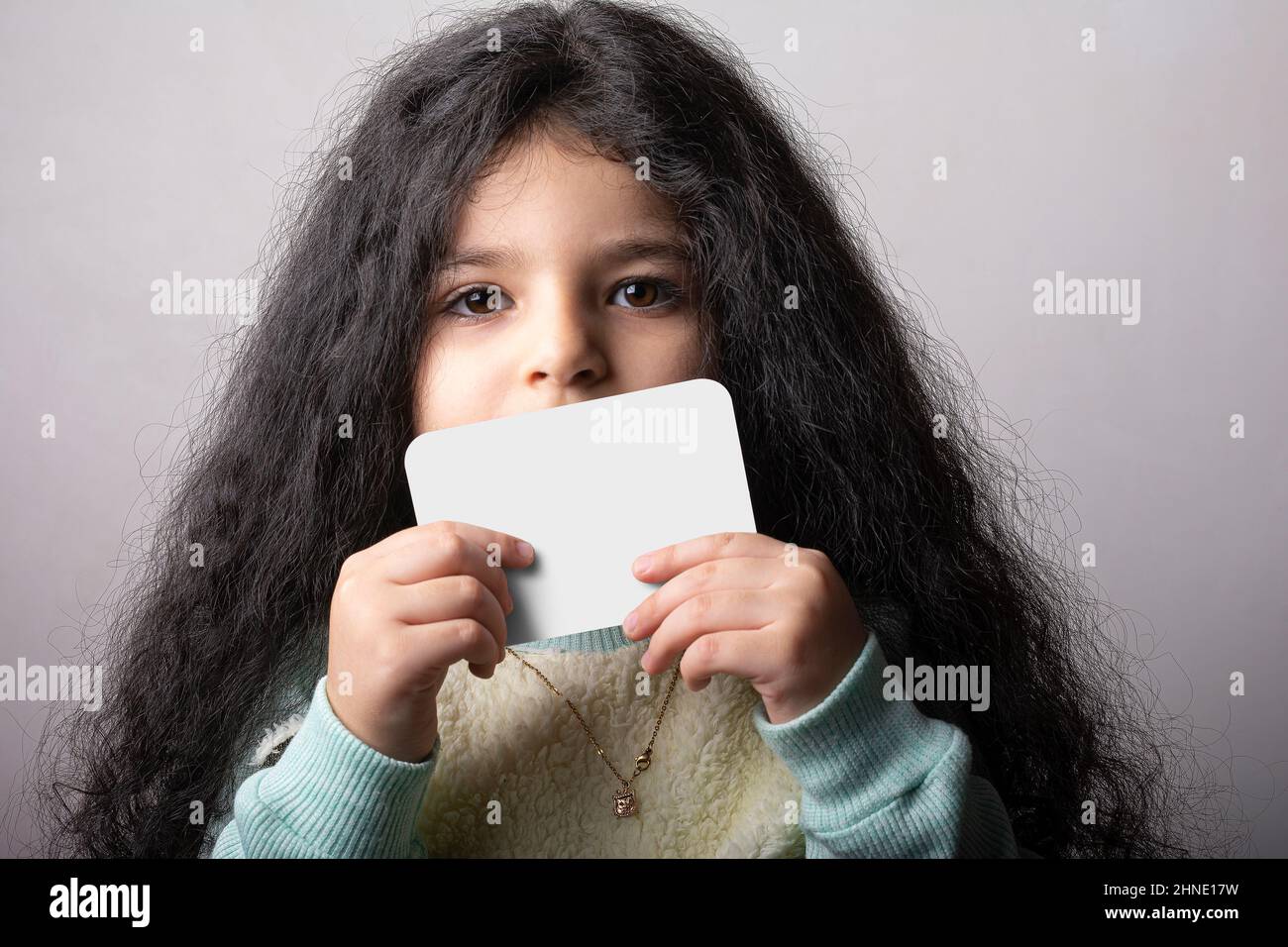 Little girl portrait with flash card, preschool educational material ...