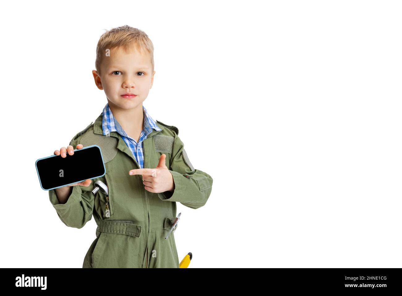 Happy little boy, cute kid in image of auto mechanic or fitter in green ...