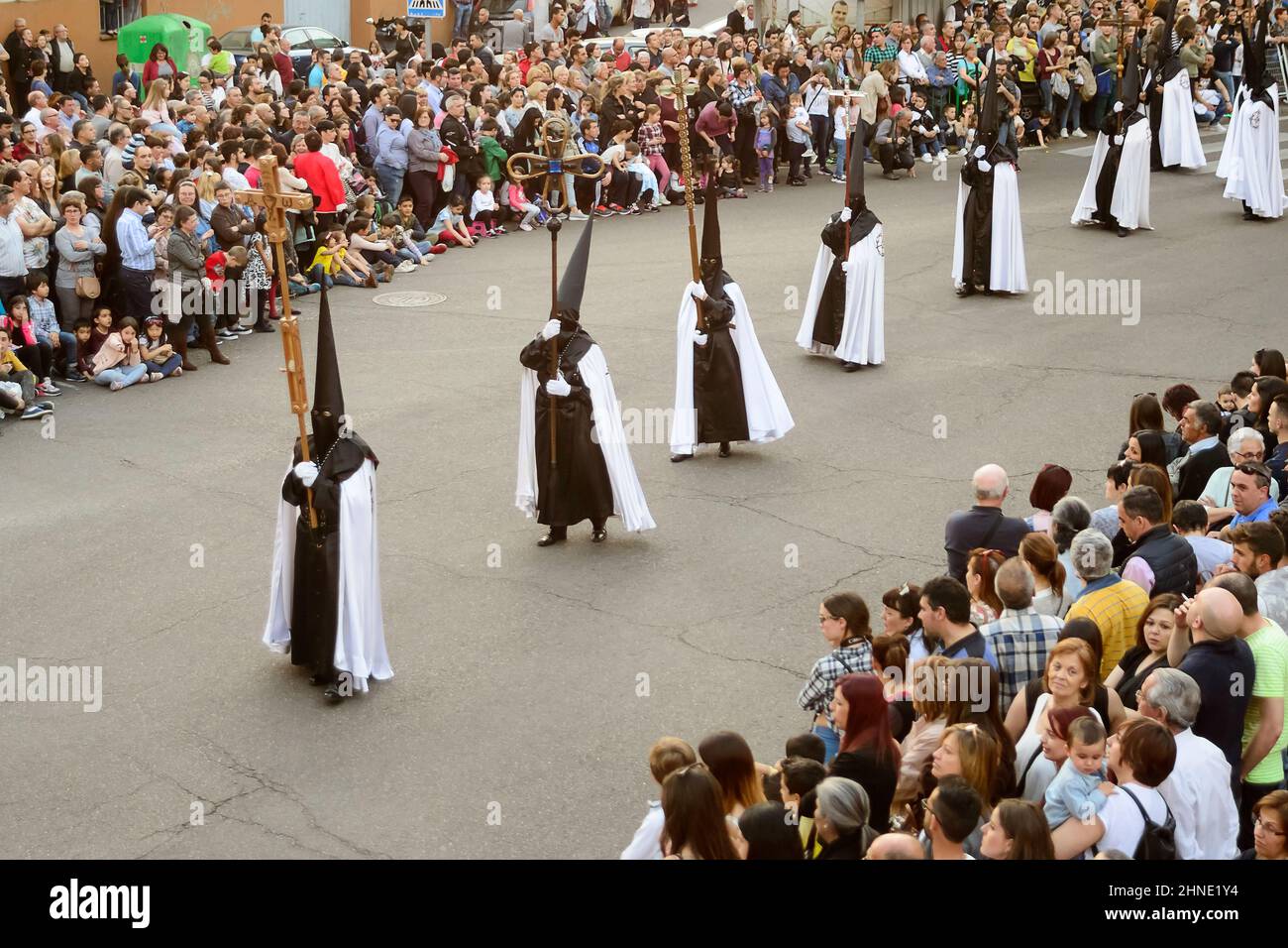 Penitents with crosses in the Easter Week Procession of the Brotherhood ...
