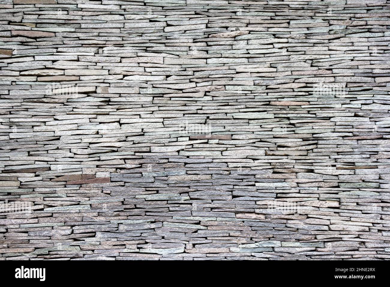 Stone wall in full frame as background and texture Stock Photo - Alamy