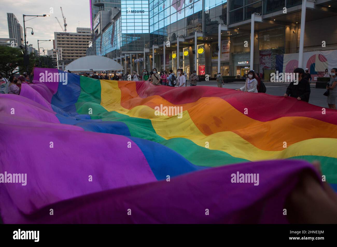 Activist LGBTQ people march with rainbow flags, shout out for equal ...