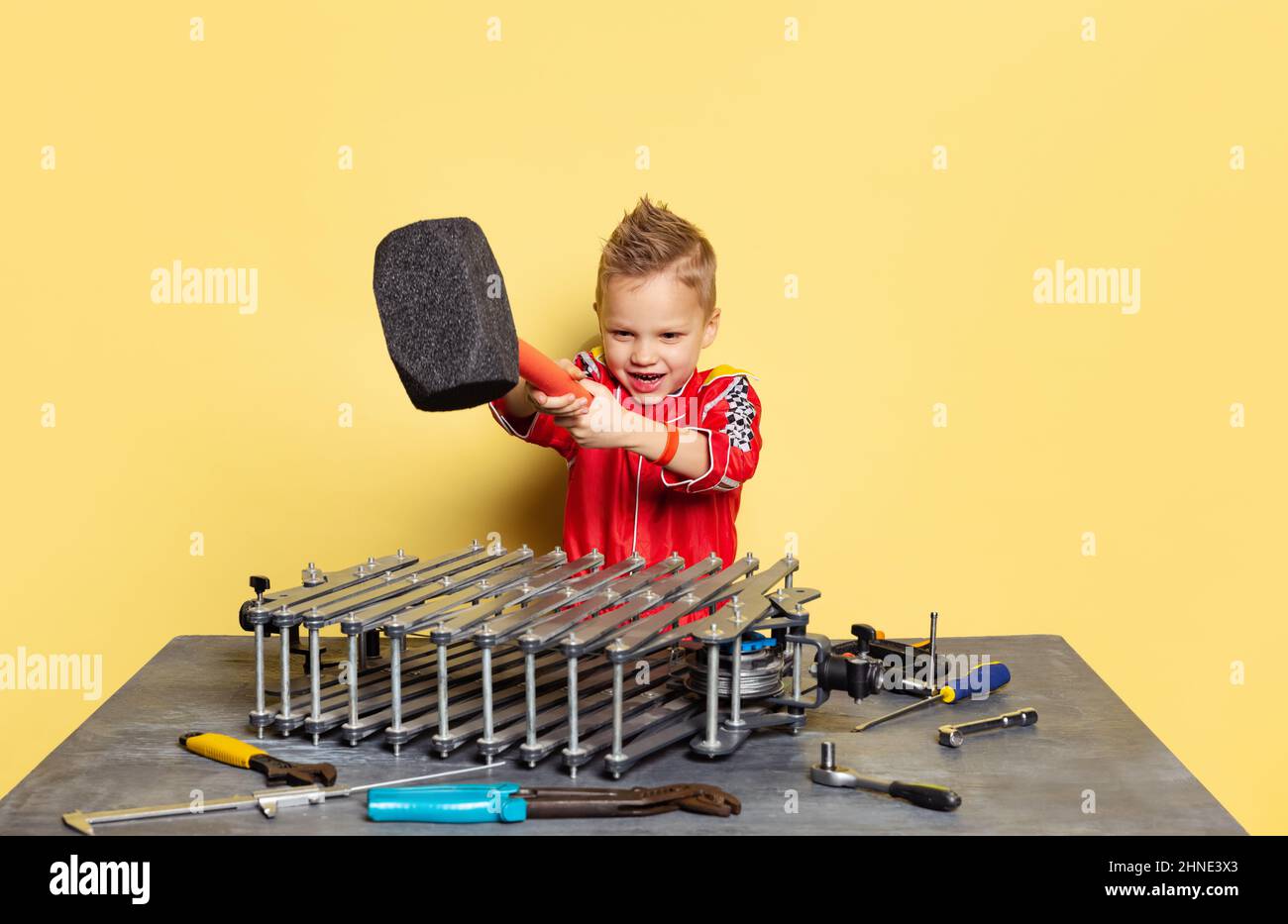 Cute little boy, child in image of auto mechanic or fitter in dungarees ...
