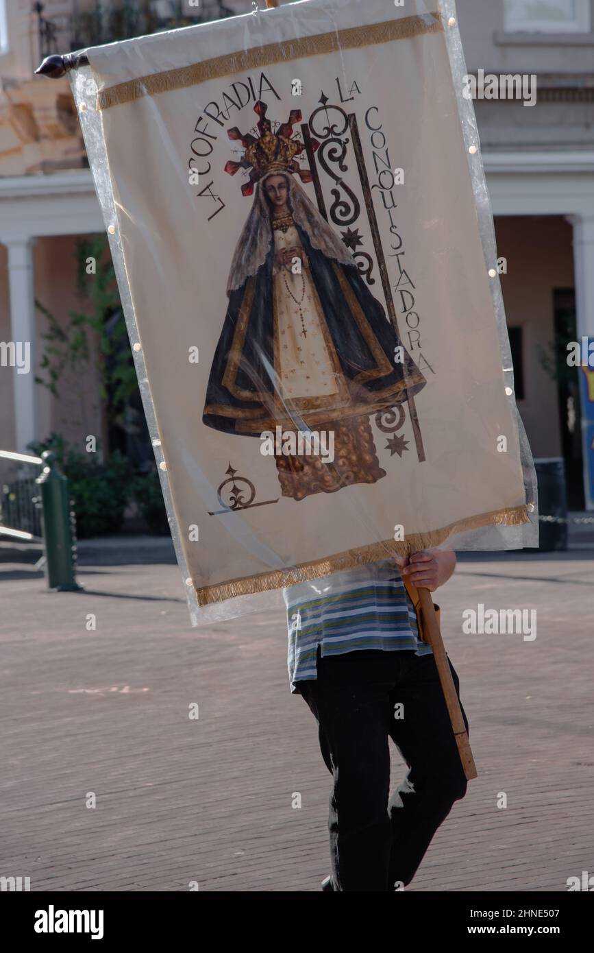 A Roman Catholic layman carries a banner picturing La Conquistadora in ...