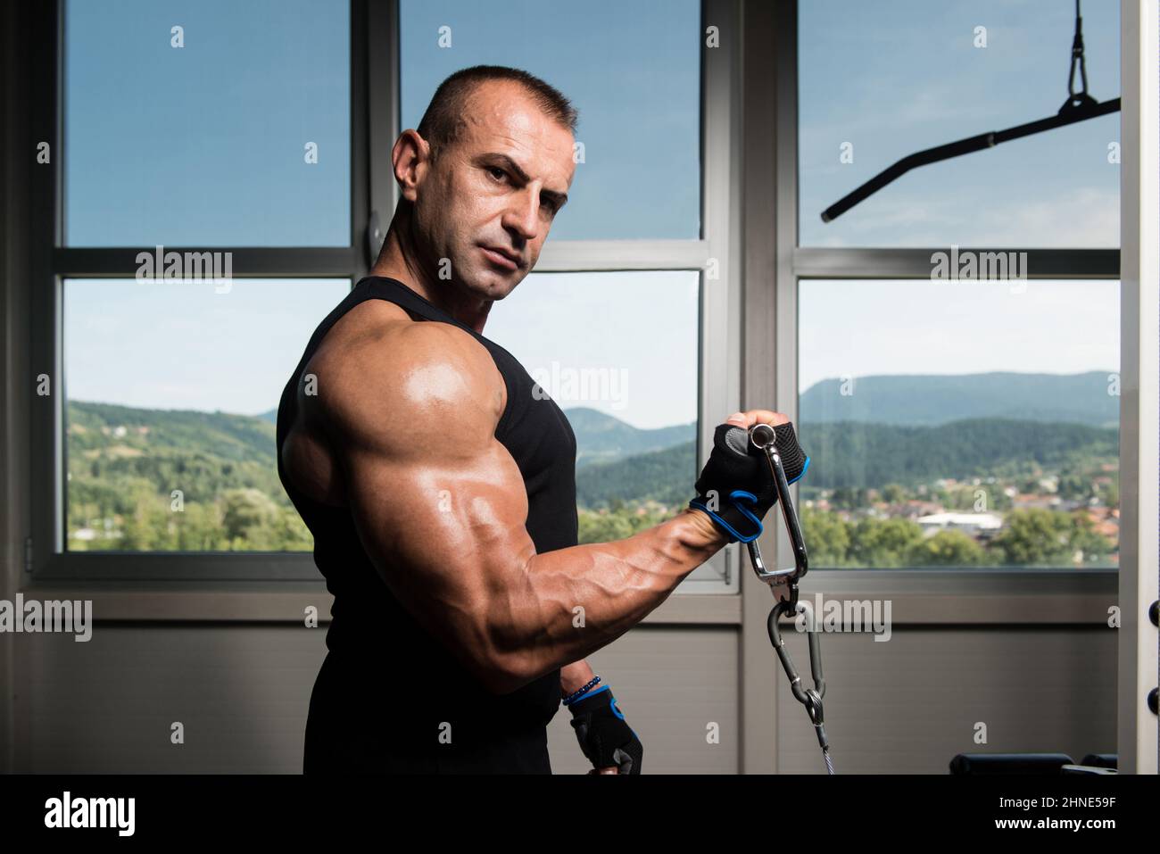 Bodybuilder Doing Heavy Weight Exercise For Biceps Stock Photo - Alamy
