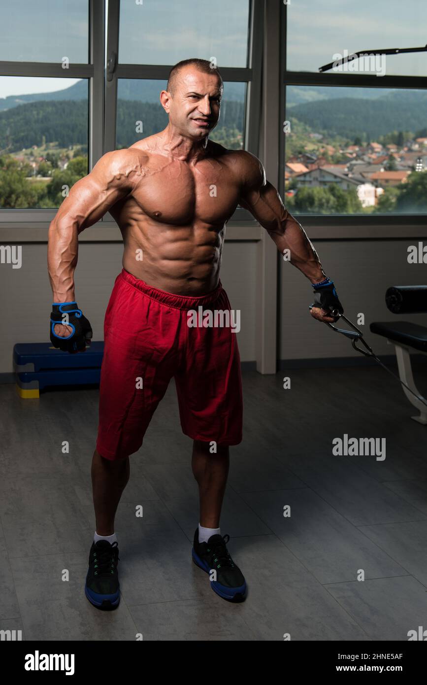 Chest Workout Cable Crossover In Gym Stock Photo - Alamy