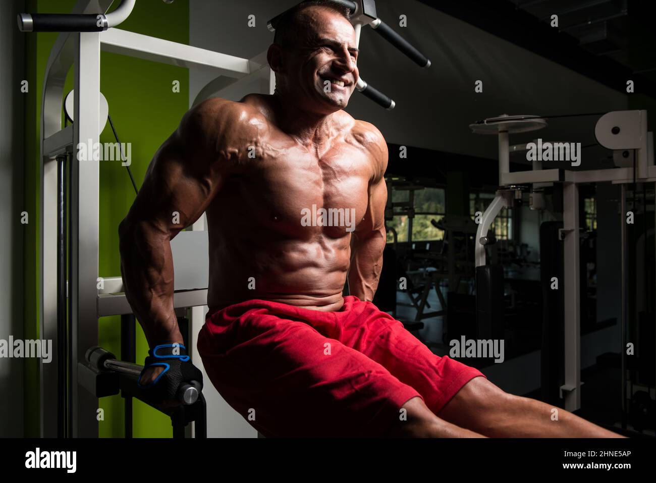 Muscular Fitness Bodybuilder Doing Heavy Weight Exercise For Triceps ...