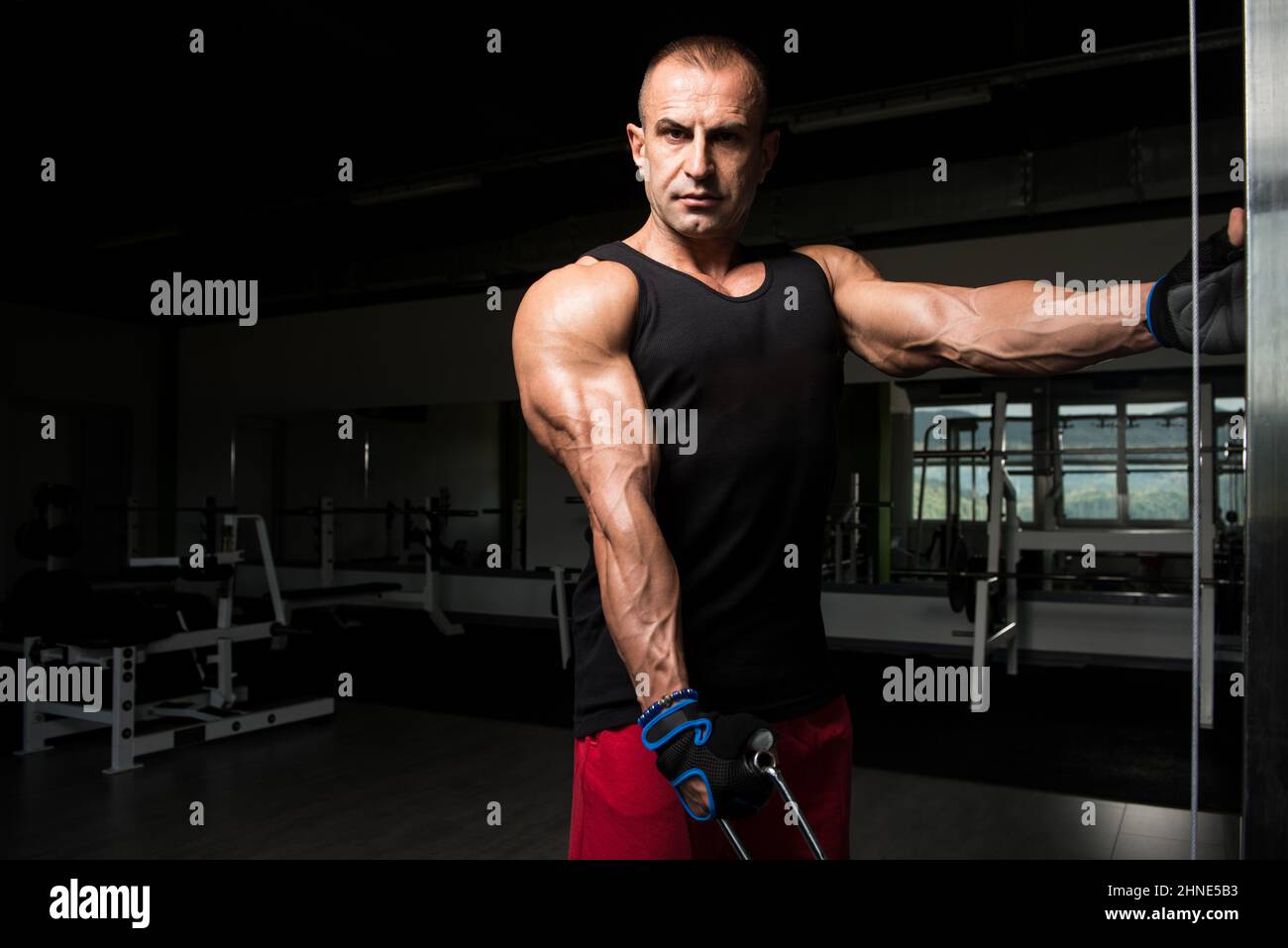 Bodybuilder Doing Heavy Weight Exercise For Biceps Stock Photo - Alamy