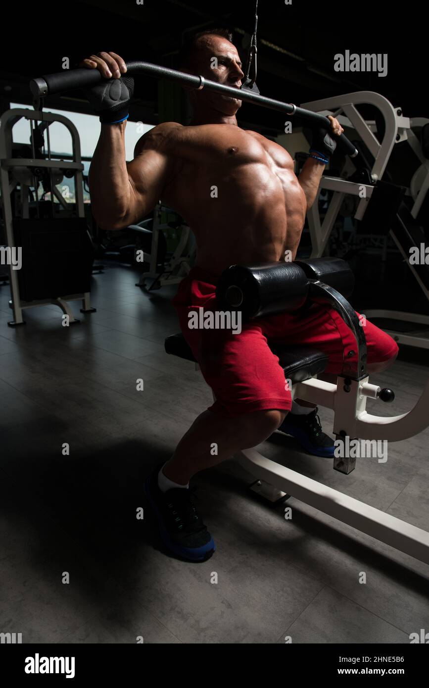 Bodybuilder Exercising Back In Gym Stock Photo - Alamy