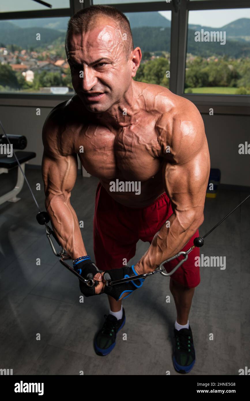 Chest Workout Cable Crossover In Gym Stock Photo - Alamy