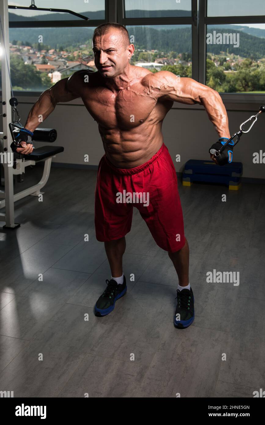 Chest Workout Cable Crossover In Gym Stock Photo - Alamy